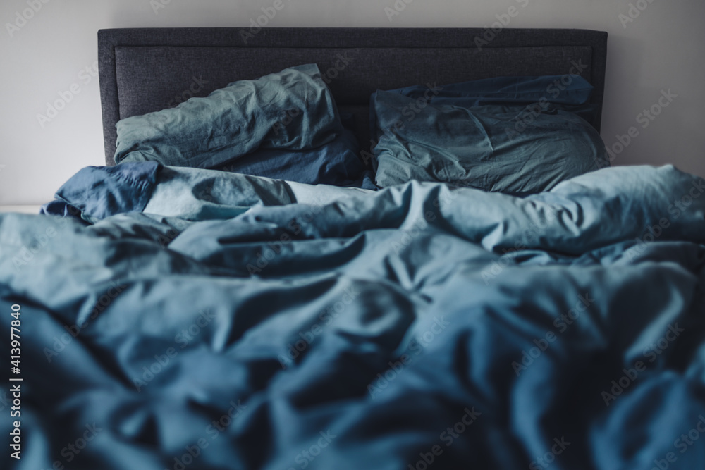 sleep or couples life, messy queen size bed with blue quilt cover and ...