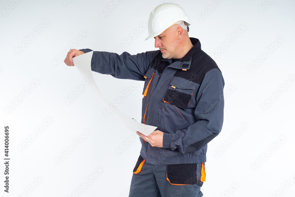 Master examines the papers. Builder holds an architectural drawing plan ...