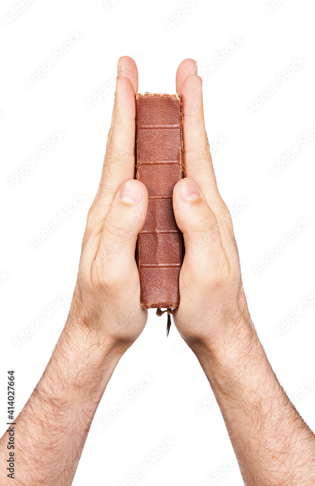 Praying hands holding the old bible Stock Photo | Adobe Stock