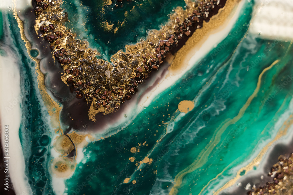 beautiful flows of different shades of green resin combined with gold ...
