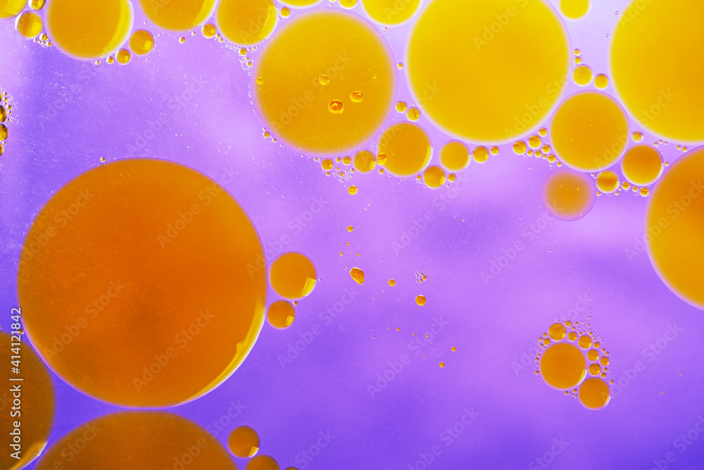 Oil drps in a water .Abstract bubbles on a purple background ...