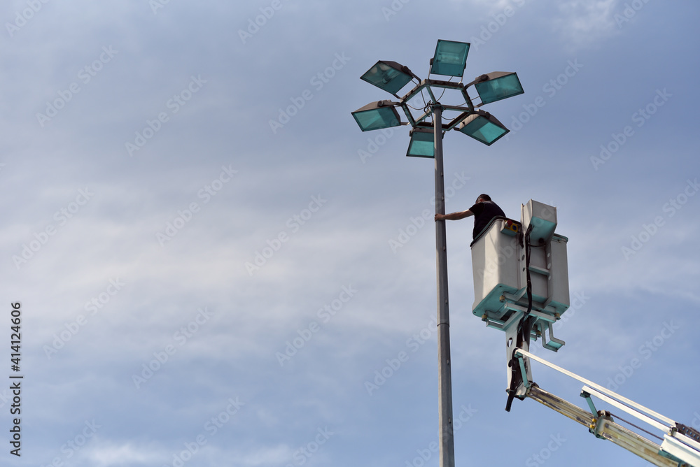 maintenance of a lamp post for city lighting with help self-propelled ...