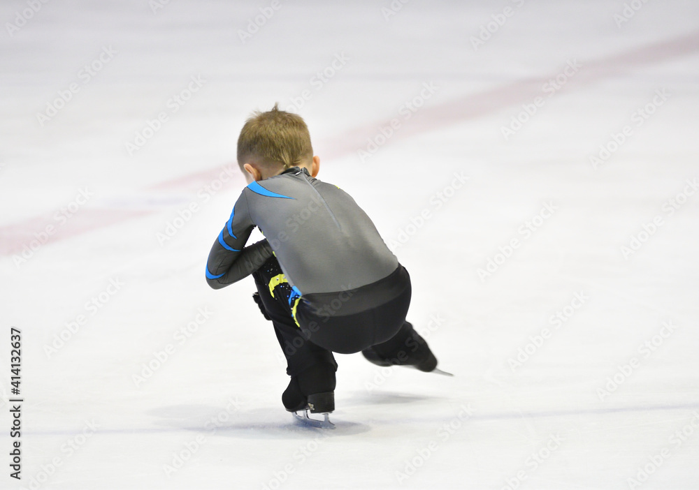 Boy figure skating Stock Photo | Adobe Stock