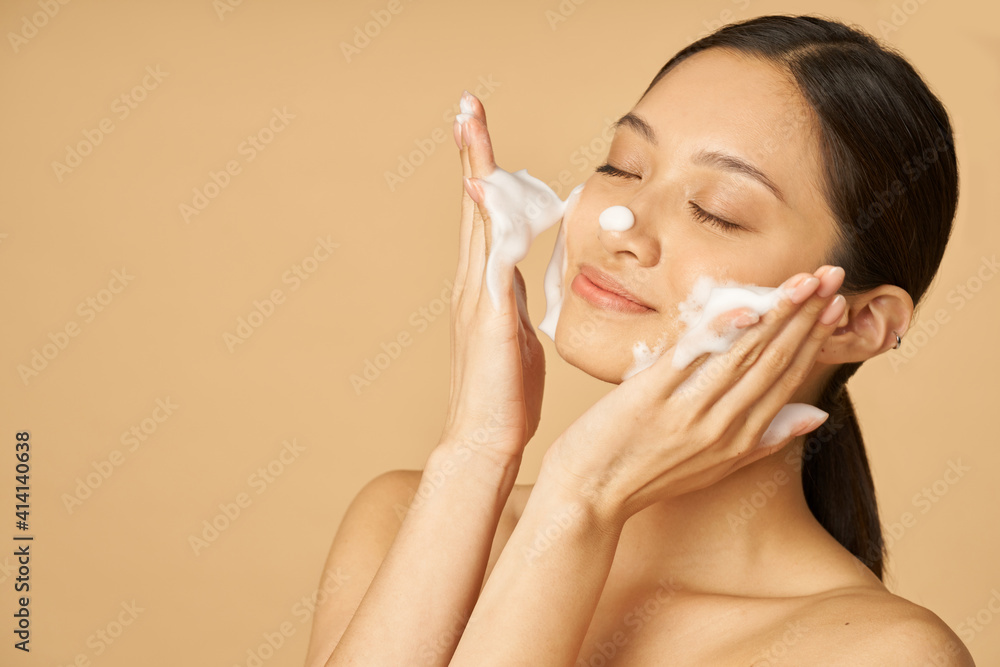 Beauty portrait of happy young woman smiling with eyes closed while ...