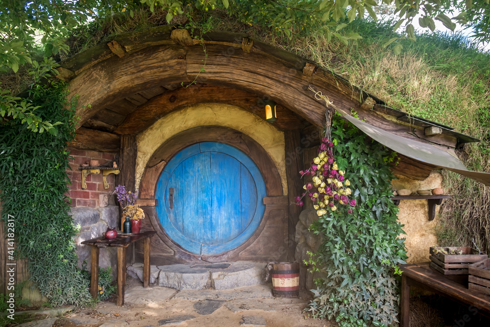 Blue door of a Hobbit house in the Hobbiton movie set in New Zealand in ...