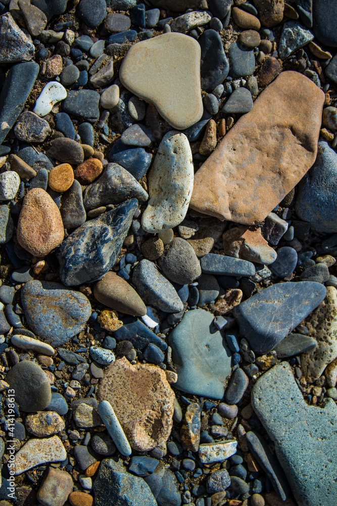Flat river rock and stone texture with igneous, sedimentary, and ...