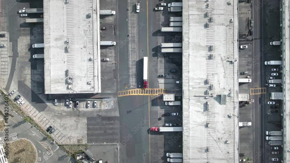 Aerial view of semi trucks with cargo trailer parking. loading ...