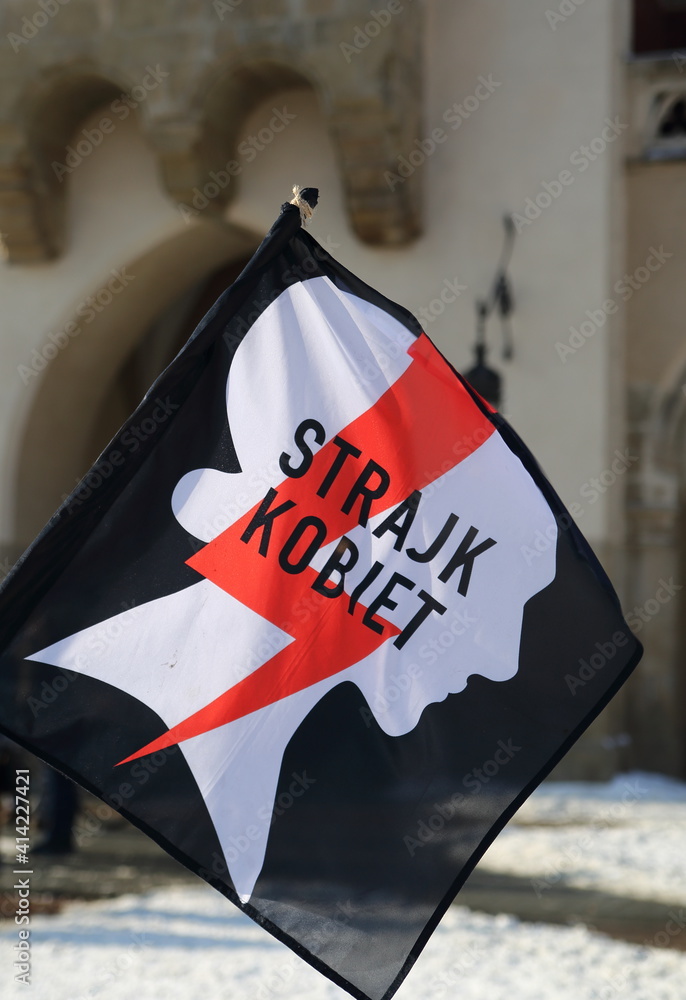 Flag with symbol and logo of Women Strajk close up against building ...