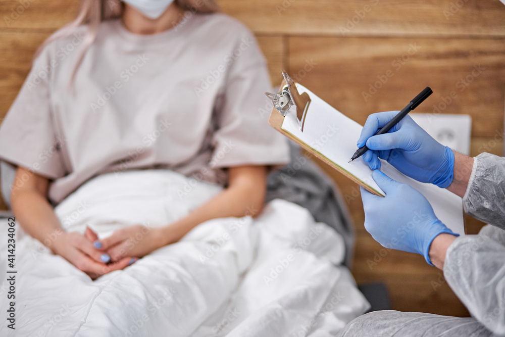 doctor asks female patient about state of health, professional doctor ...