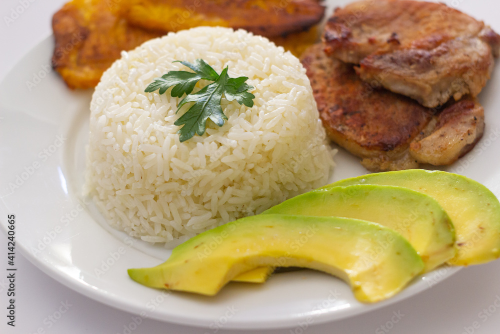 dominican lunch plate, fried tostones, white rice accompanied with ...