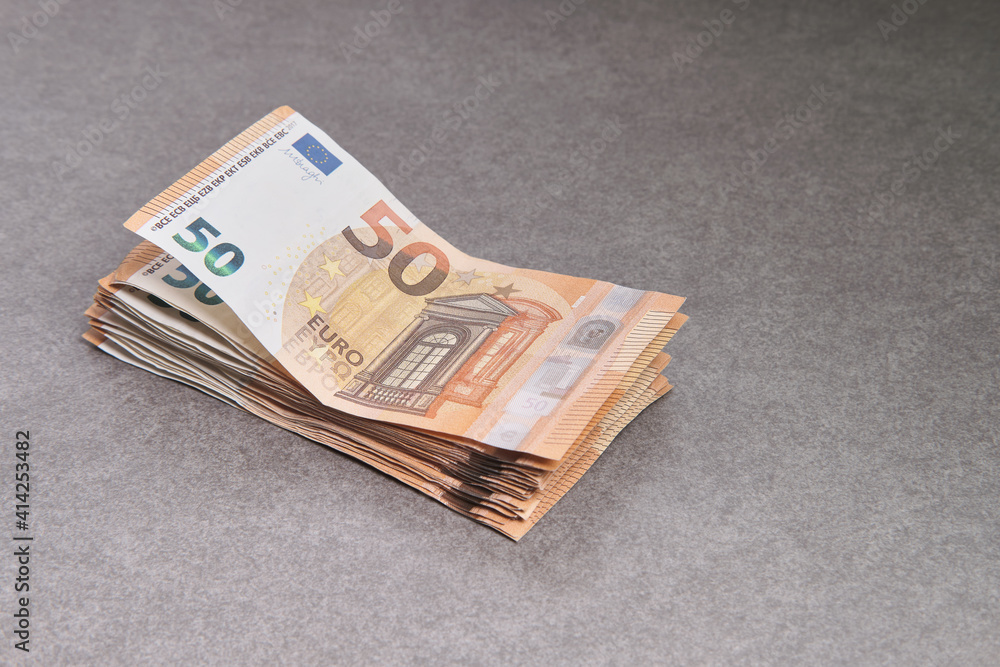 Pile of fifty euro banknotes. 50 euro currency notes stacked on rustic ...