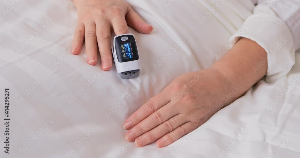 Pulse oximeter at home or clinic show oxygen saturation level in blood ...