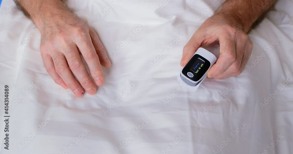 Pulse oximeter at home or clinic show oxygen saturation level in blood ...