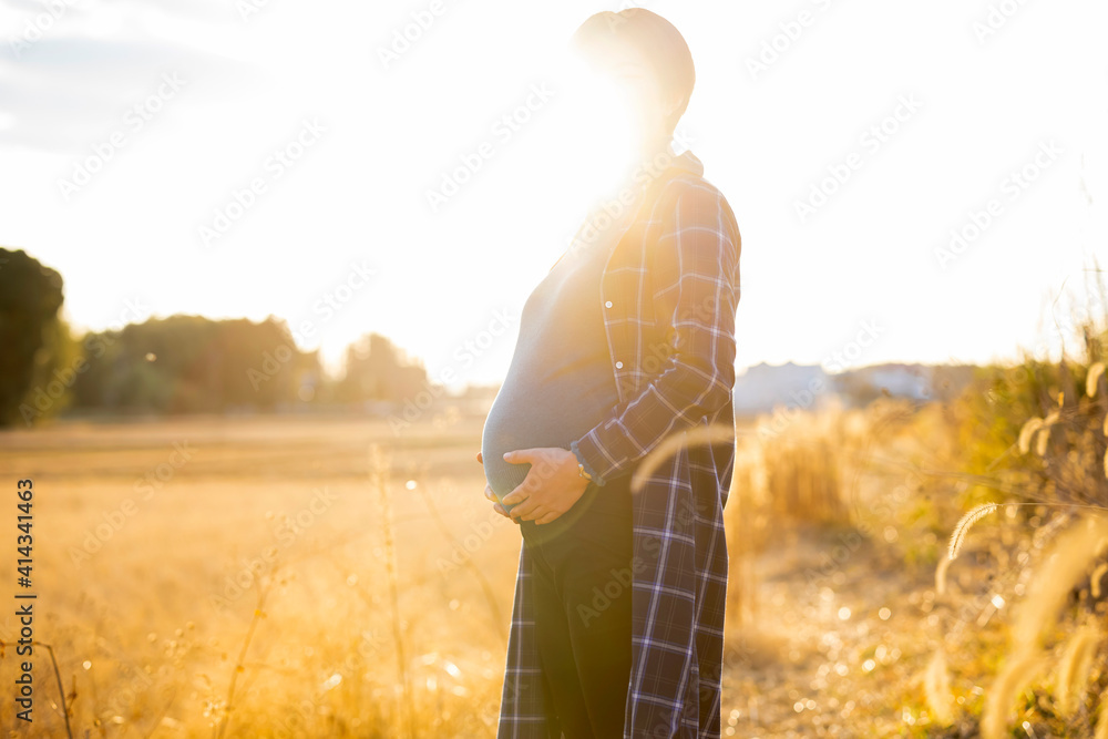 A Japanese woman who is pregnant and close to giving birth. Outside in ...