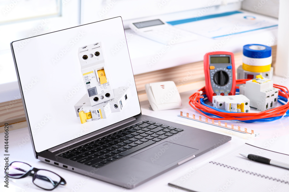 . Electrical installation courses. On the table there is a computer ...