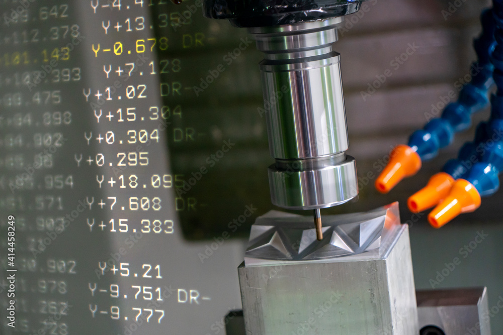 Abstract scene of CNC milling machine and G-code data background. The ...