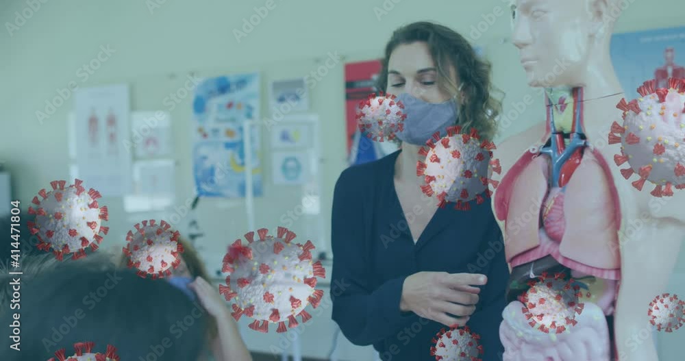 Multiple covid-19 cells floating against female teacher teaching ...