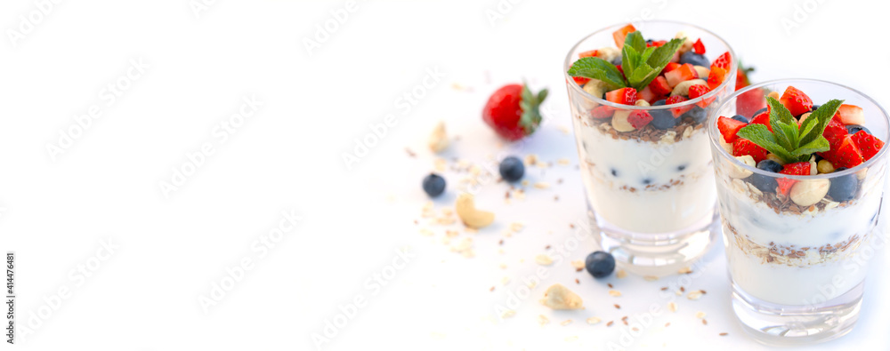 Banner. Two glasses of strawberry parfait made with fresh fruit, yogurt ...