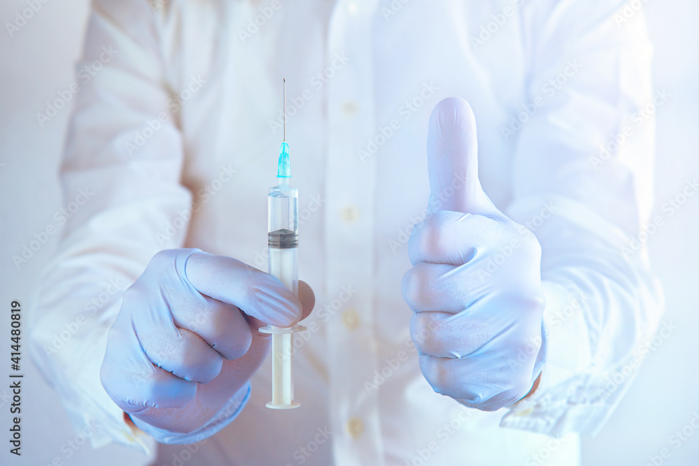 Syringe and like gesture. Male hands showing a vaccine (or medicine ...