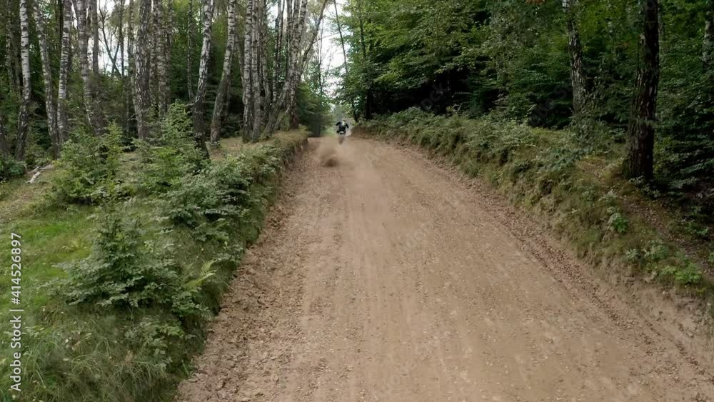 Racer On Sports Motorcycle Rides At High Speed On Dirt Road. Aerial ...
