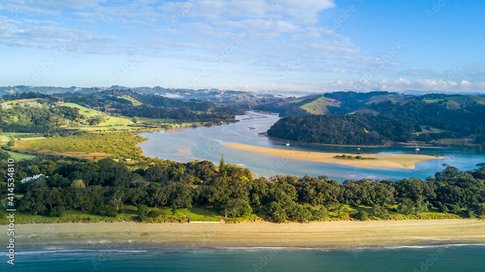 Aerial view of a beautiful river running through a green hillside to ...