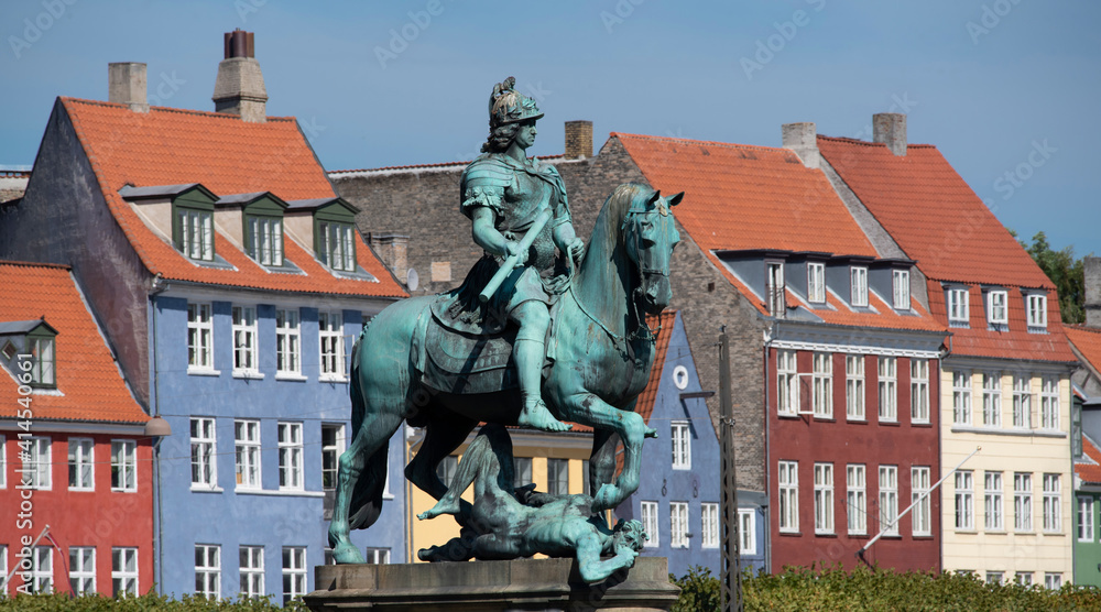 Denmark, Copenhagen, Nyhavn district in city center. Statue of the ...