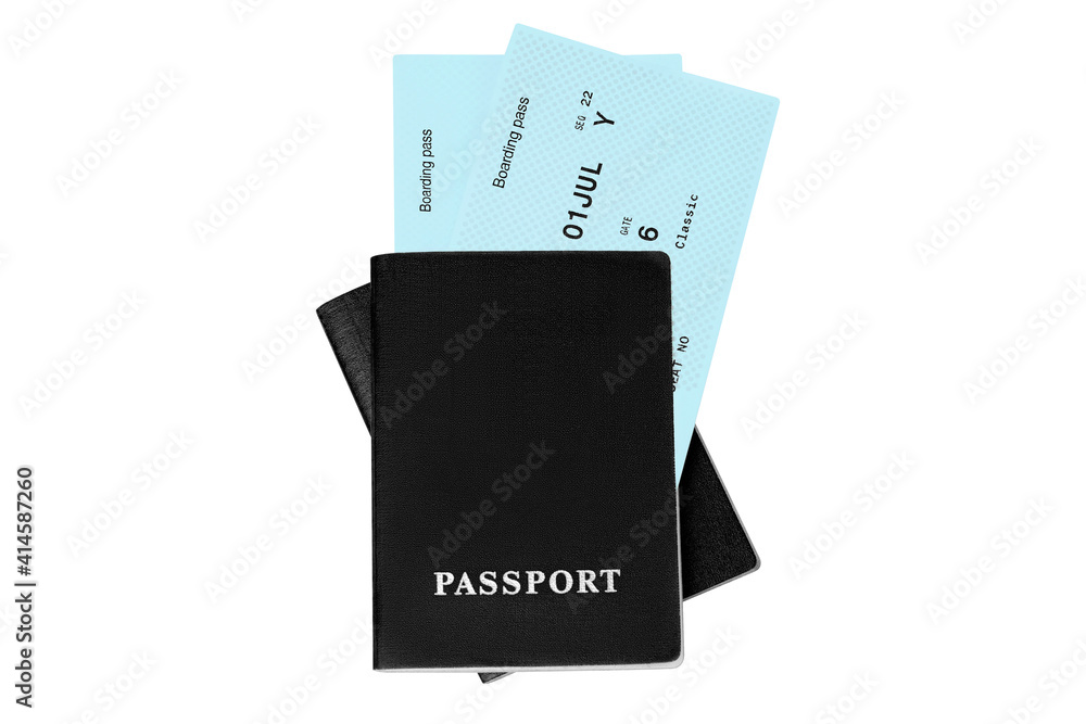 Two black passports, blue boarding pass, flight tickets white ...