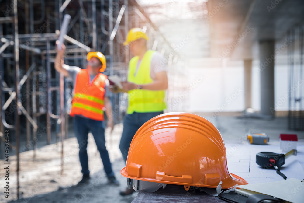 The yellow safety helmet in construction site and construction site ...