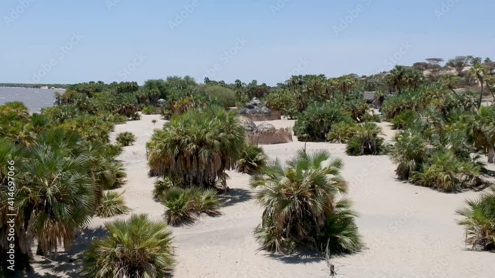 Side view of Round traditional hut made from Palm tree leaves of the ...
