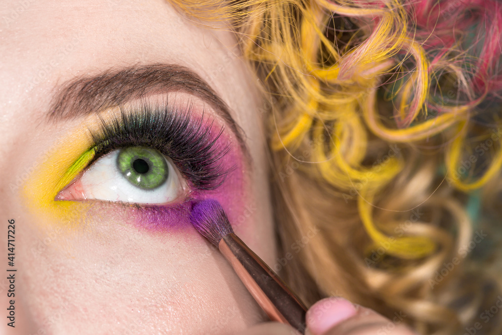 Rainbow multicolor stage makeup for the eyes for parties and discos ...