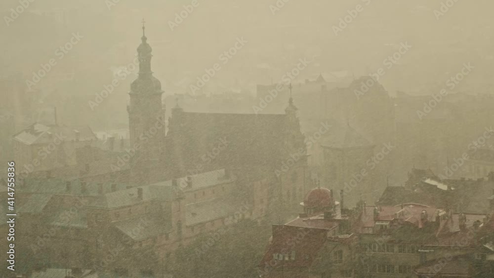 Rain in the city. European city aerial view with colourful roofs and ...