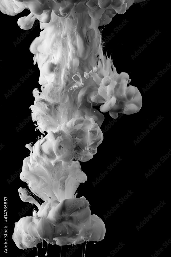 Ink dropped into the water and photographed while in motion. Paint ...