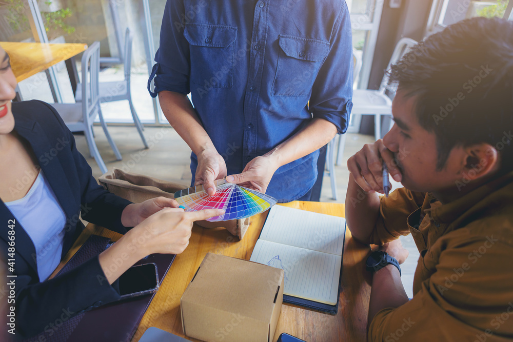 Team designer working graphic packaging design with color chart and ...