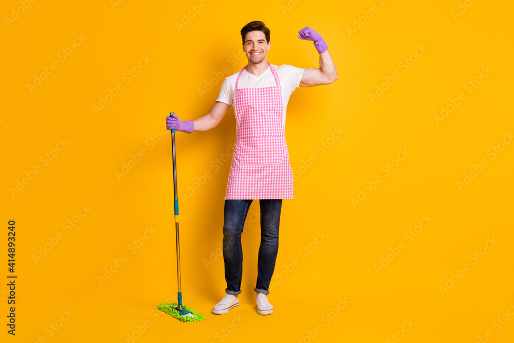 Full size photo of positive man arm flex biceps hold mop have good mood ...