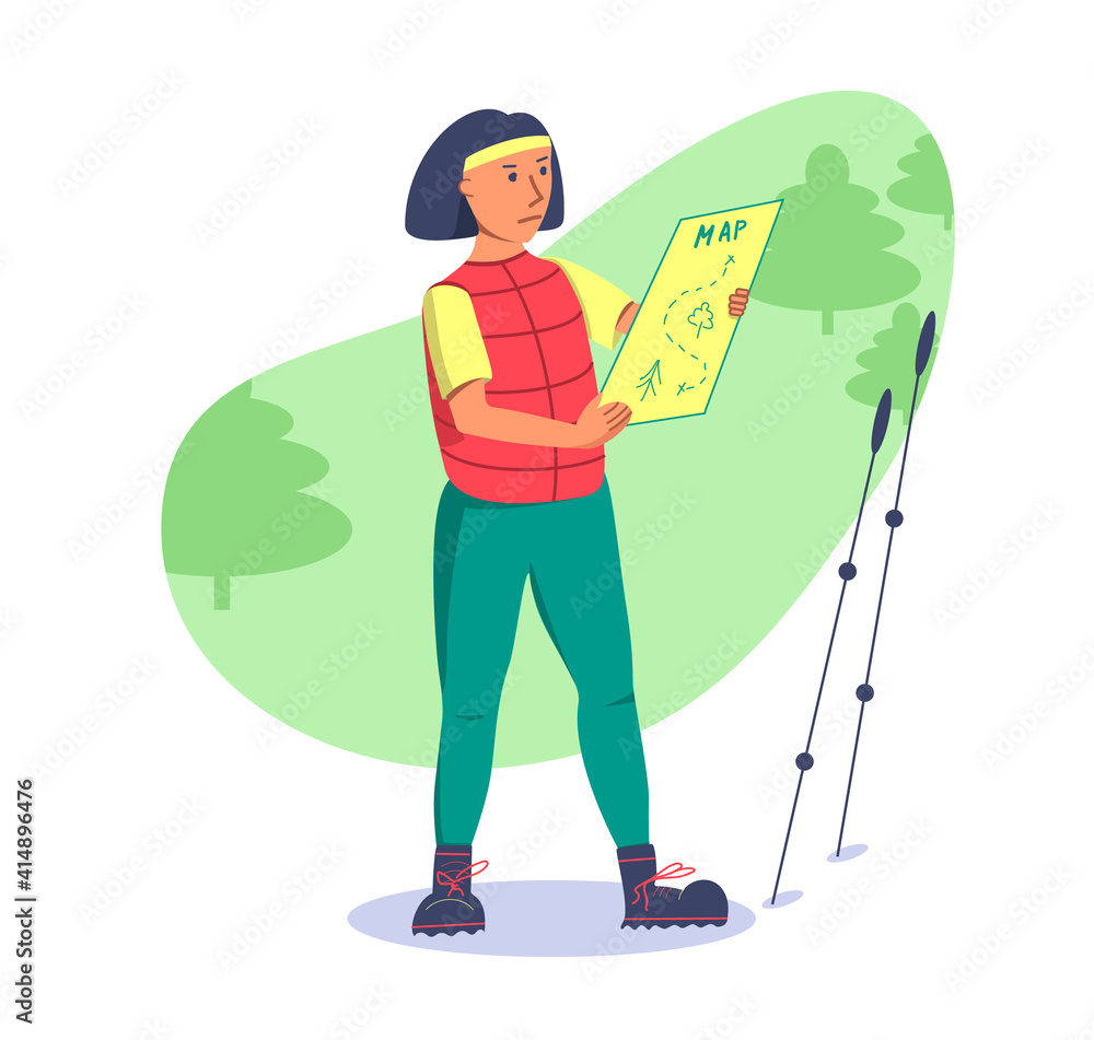 Girl is looking intently at the orienteering map on a hiking trail in ...