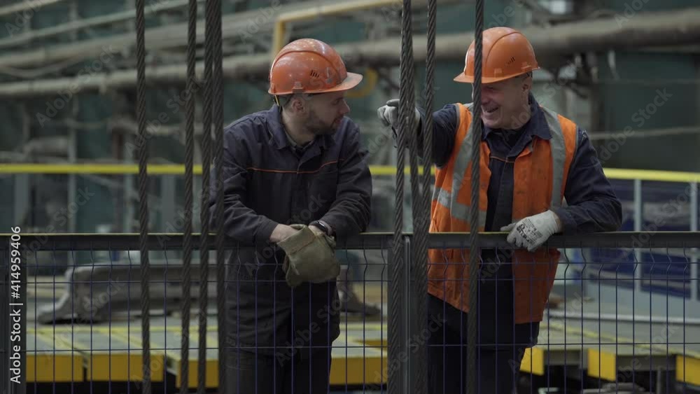 Two Male Factory Workers Having a Break at a Turbine Manufacturing ...