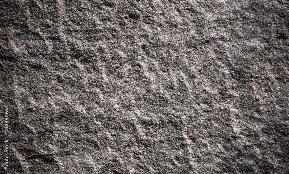 Stone texture. The rocky surface of granite. Beautiful dark texture ...