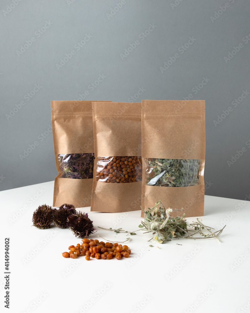 Brown kraft paper doypack bags with dried berries and medical herbs ...