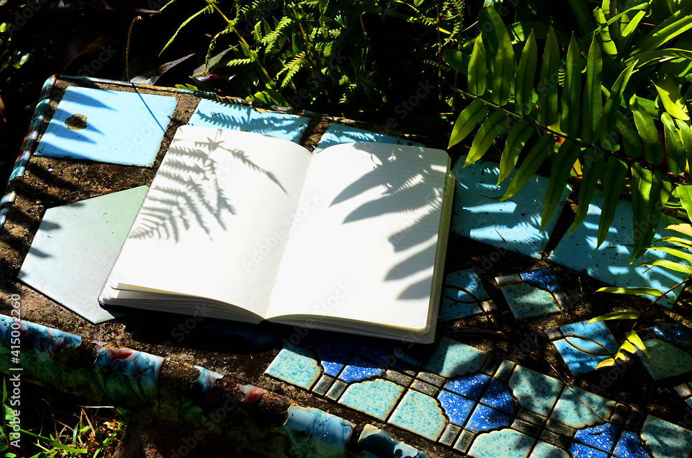 Minimal photo of book opening, spine of book on desktop. Artistic ...