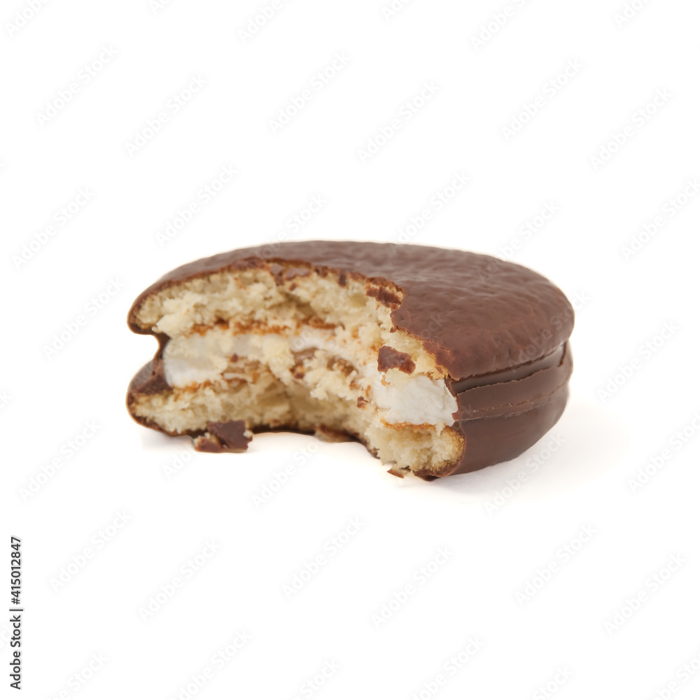 Piece of chocolate cake chokopie bitten off isolated on a white ...