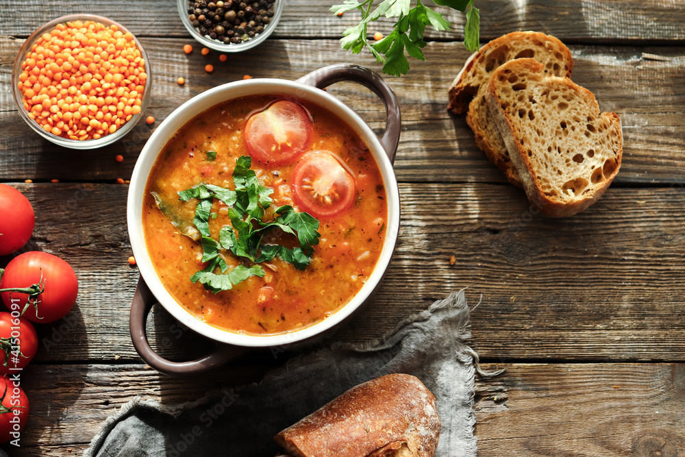 Red lentil soup and ingredients. Wooden background, top view ...