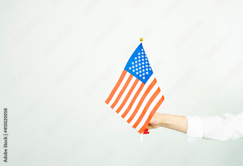 hand holding United States flag Stock Photo | Adobe Stock