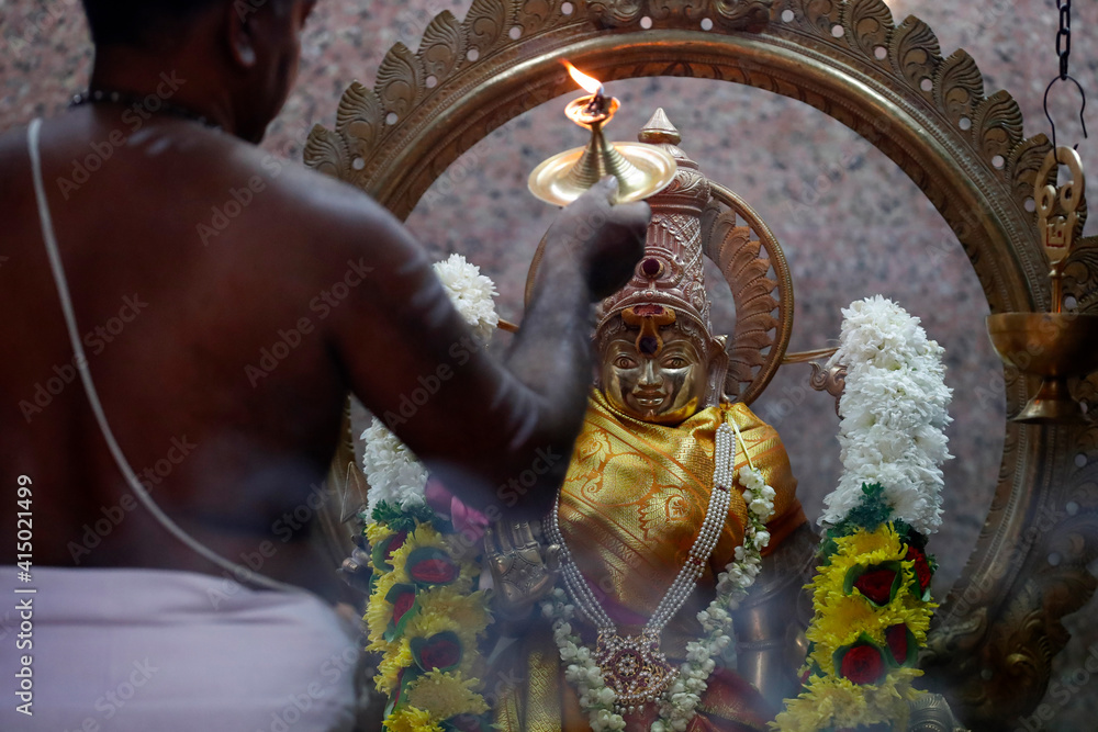 Hindu priest doing puja worship, Durga, Hindu Goddess of War, Sri ...