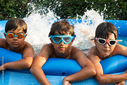 Boys in swimming pool, wearing goggles Stock Photo | Adobe Stock