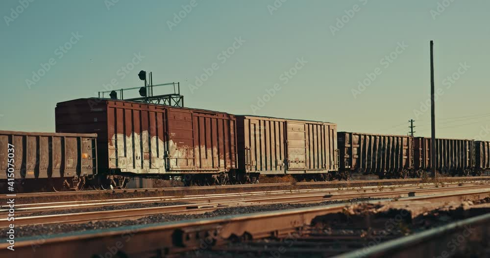 Freight Train Cargo Cars Coming to a Stop at Empty Industrial City ...