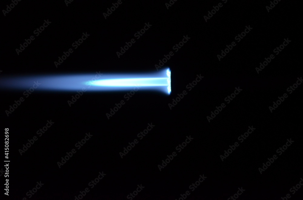 blue gas jet flame on black background Stock Photo | Adobe Stock