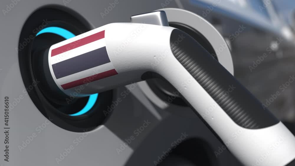 Charging plug in an electric car with flag of Thailand. Conceptual 3d ...