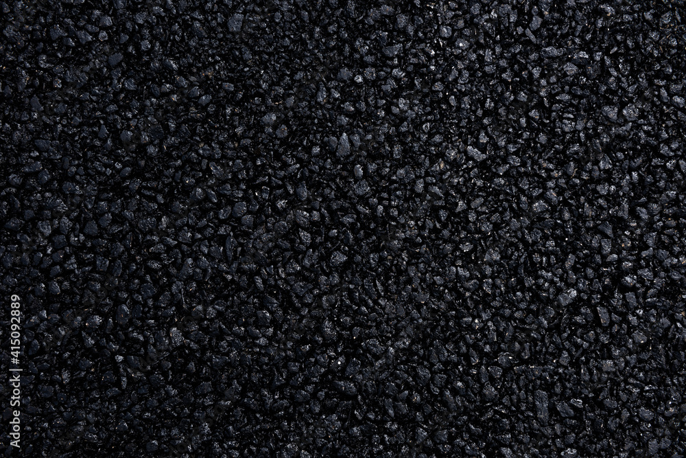Japanese asphalt pavement with a beautiful black texture and lit with a ...