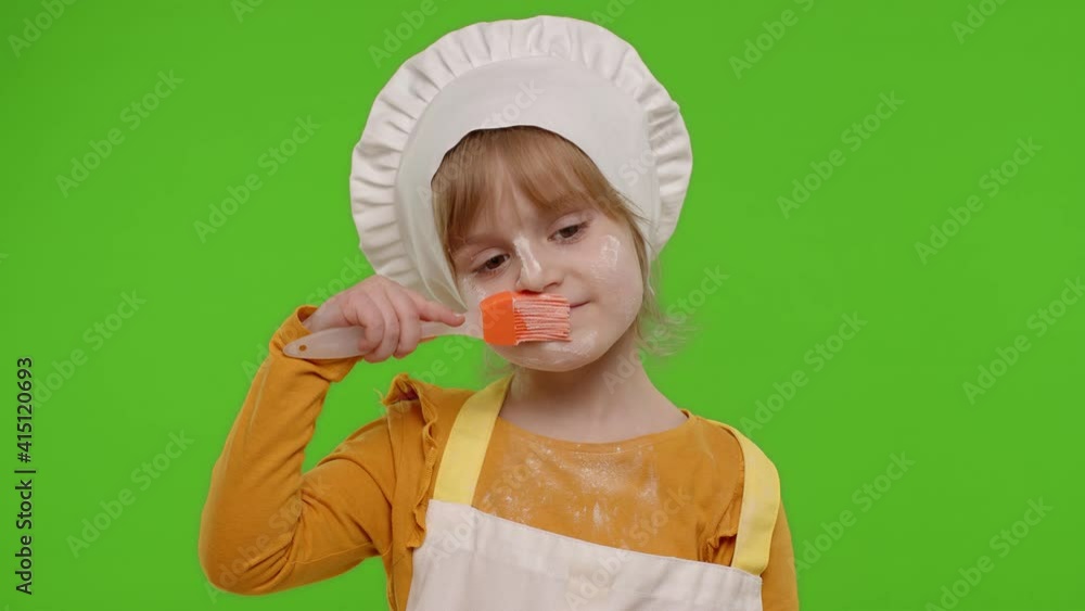Caucasian preschooler child girl dressed as cook chef baker in apron ...