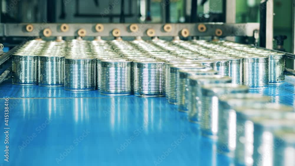 Sealed tin cans are piling up on the conveyor Stock Video | Adobe Stock